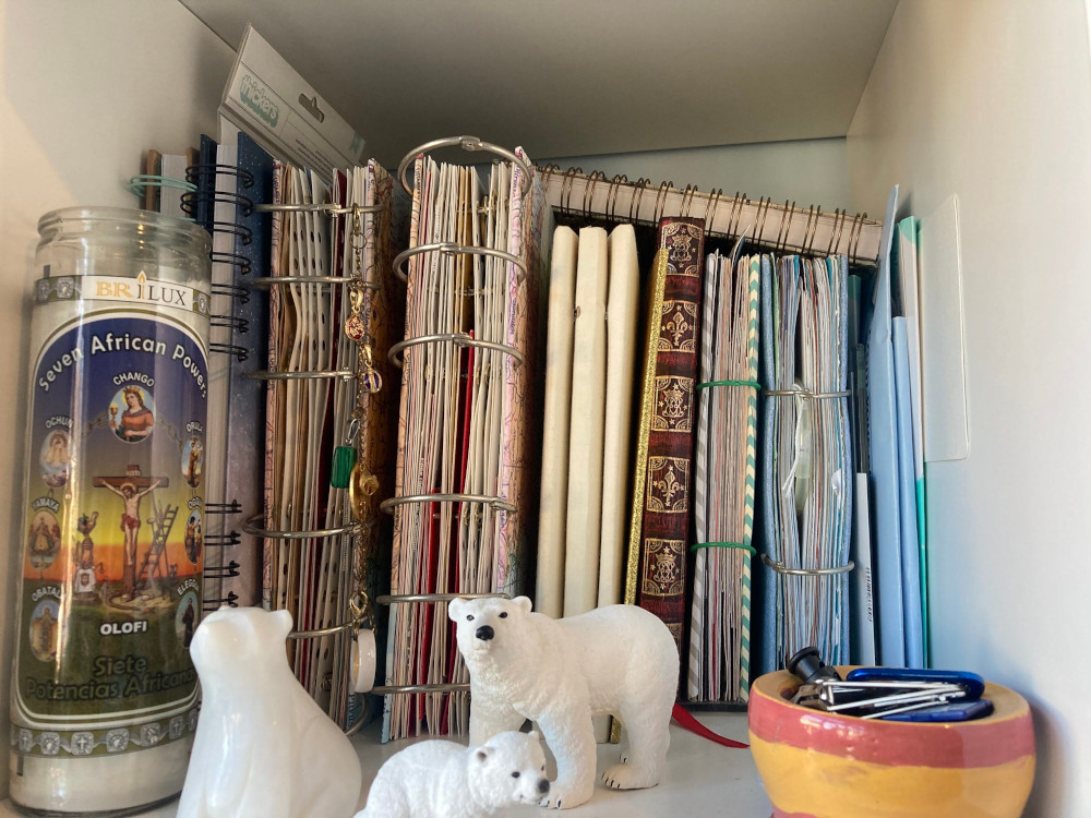 My scrapbook shelf. The back of the Ikea cube shelf is filled with ...